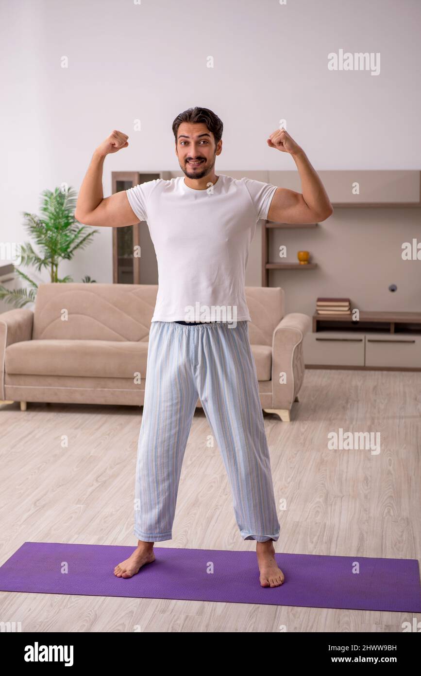 Young man doing sport exercises in the morning Stock Photo - Alamy
