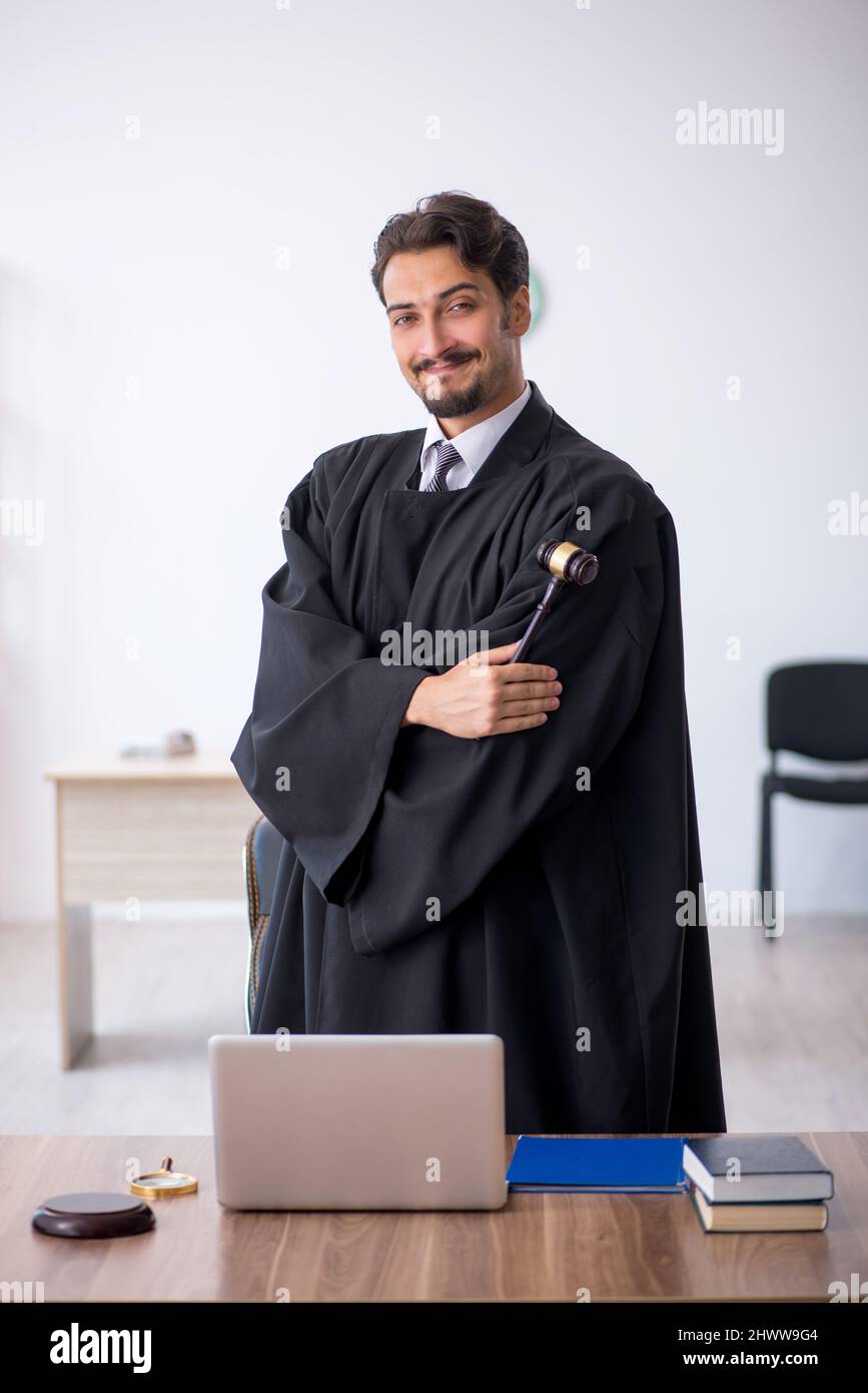 Young judge working in the courthouse Stock Photo - Alamy
