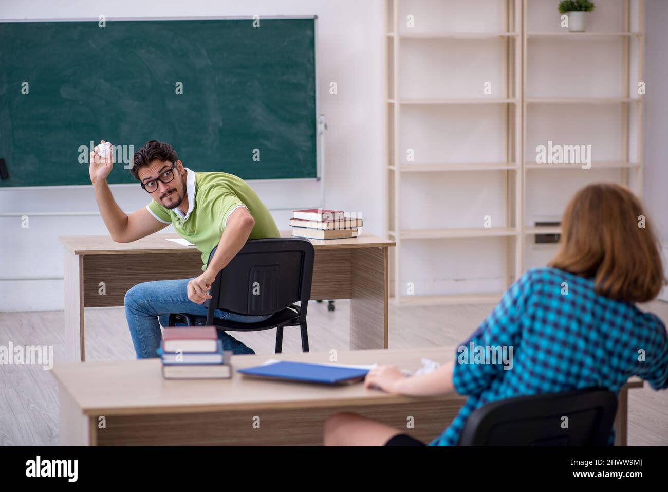Two students having fun during the lesson Stock Photo - Alamy