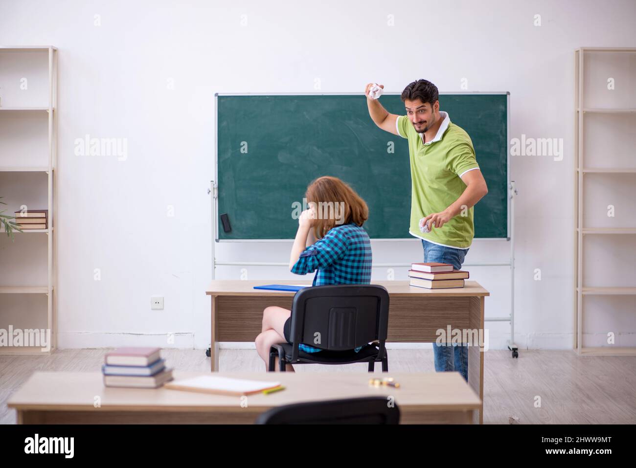 Two students having fun during the lesson Stock Photo - Alamy