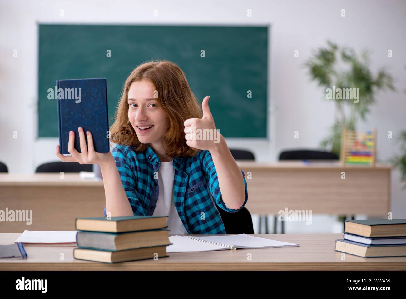 Female student preparing for exams in the classroom Stock Photo - Alamy