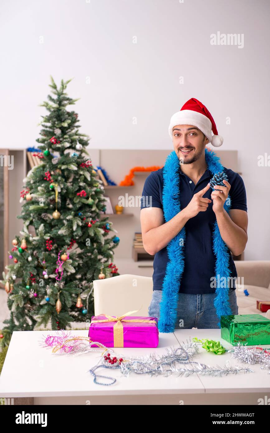 Young man celebrating New year at home alone Stock Photo - Alamy