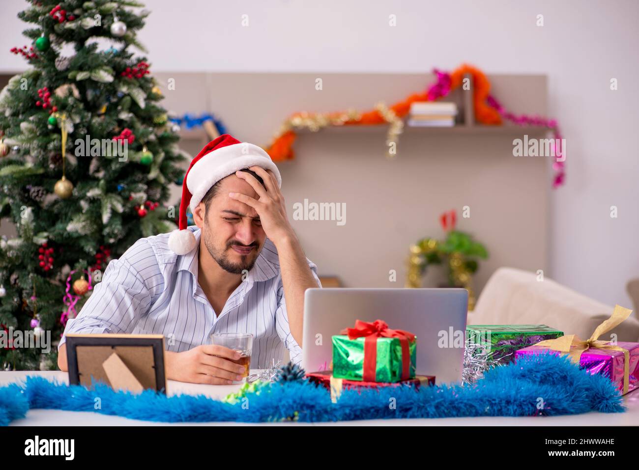 Young man celebrating New year at home alone Stock Photo - Alamy
