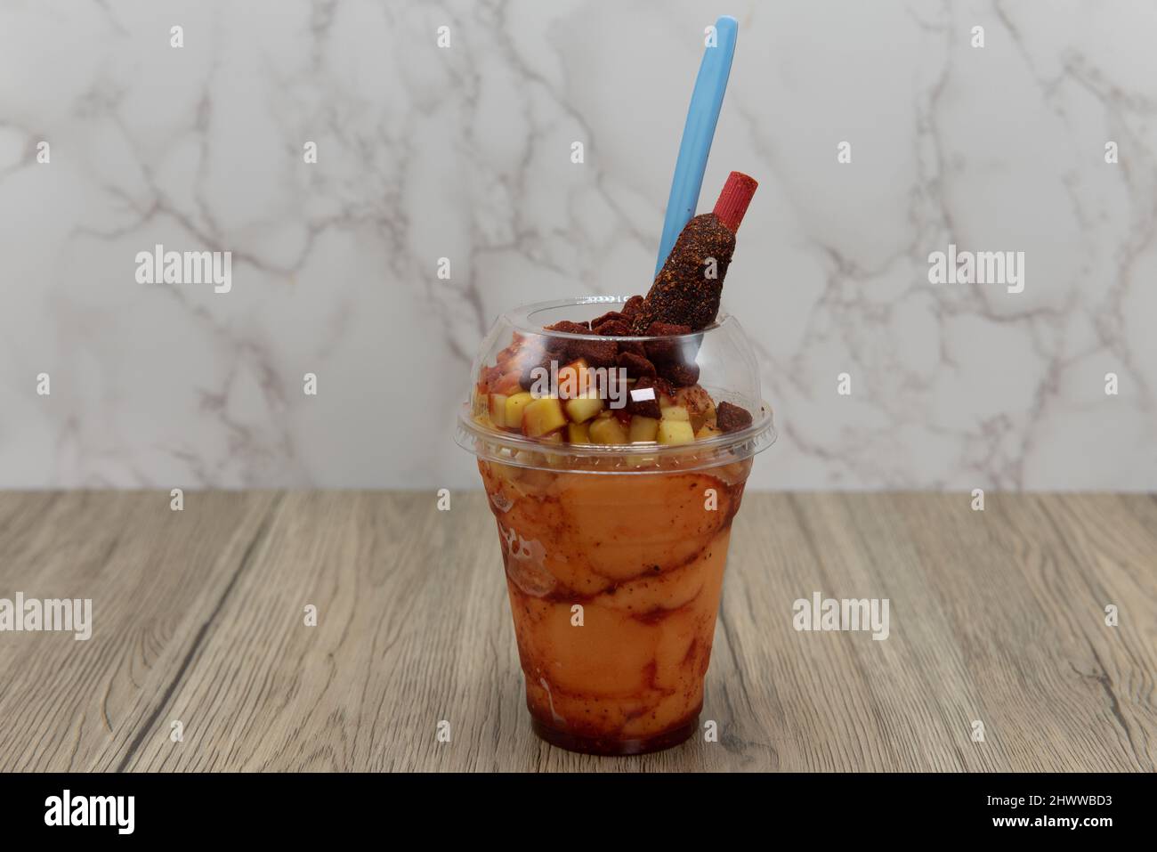 Delicious ice cold mango flavored mangoneada smoothie with chunks of ...