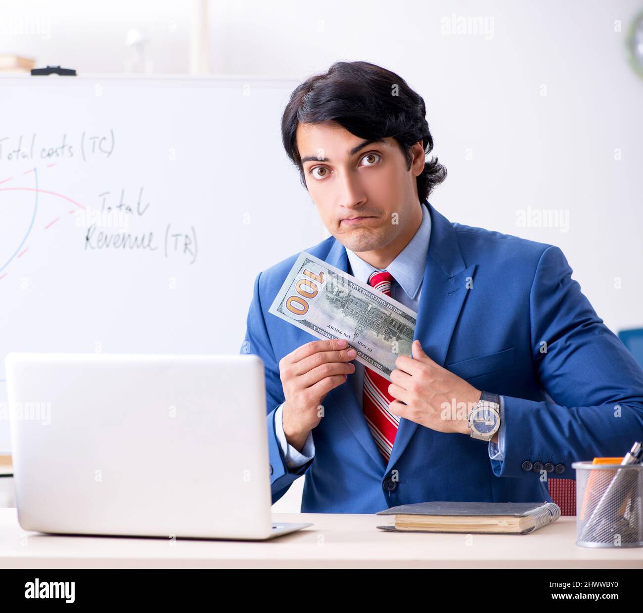 Busy businessman explaining business charts Stock Photo - Alamy