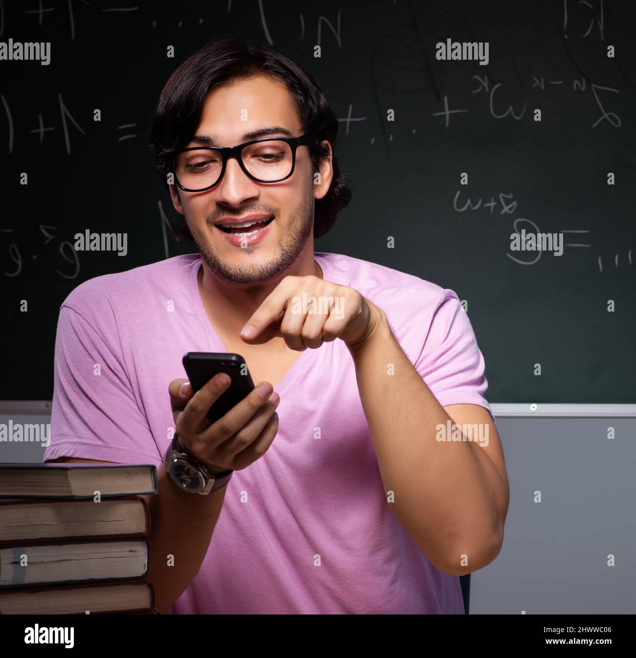 High school student texting in class hi-res stock photography and ...