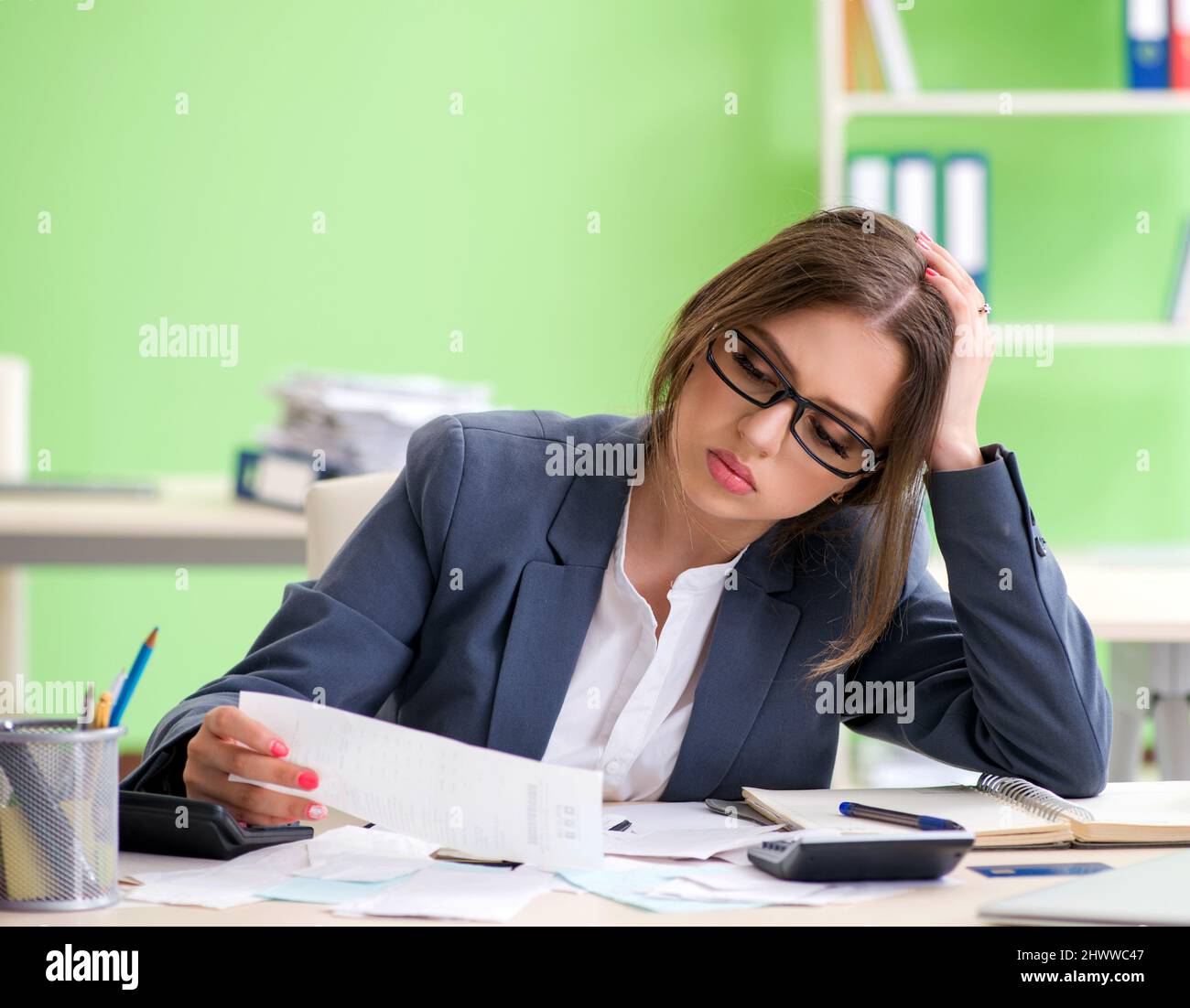 The female financial manager working in the office Stock Photo - Alamy