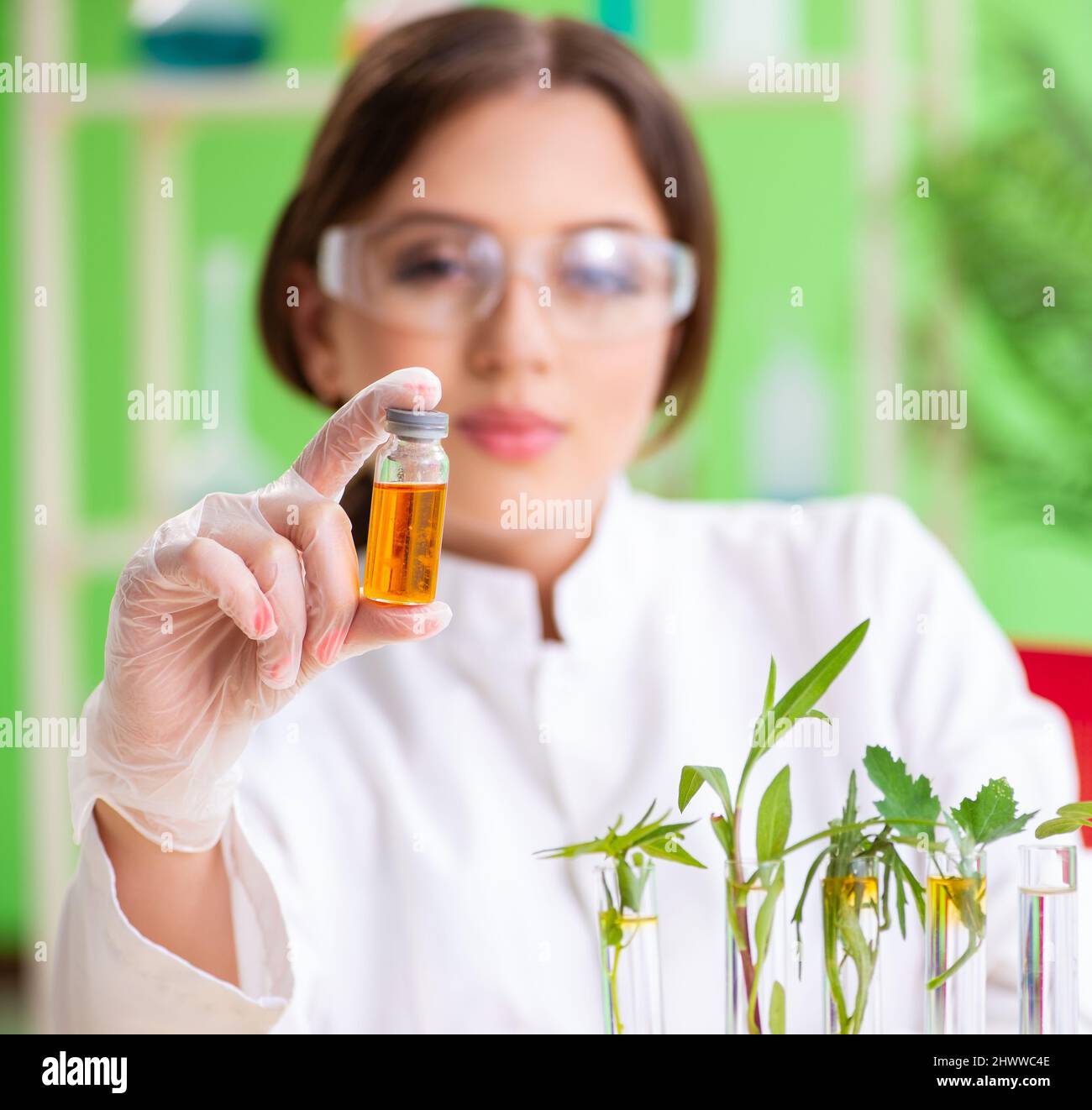 Female scientist showing vial hi-res stock photography and images - Alamy