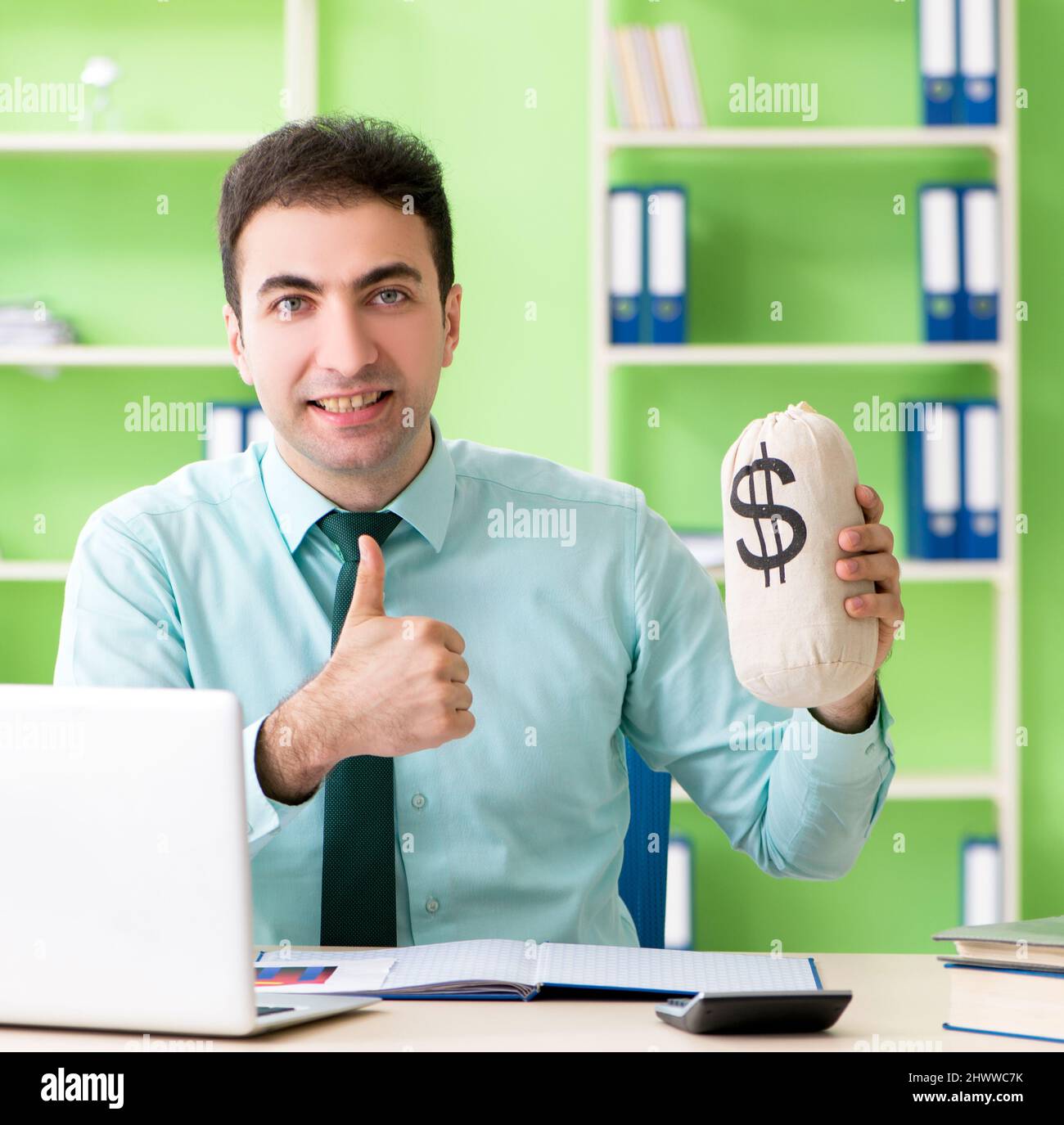The male financial manager working in the office Stock Photo - Alamy