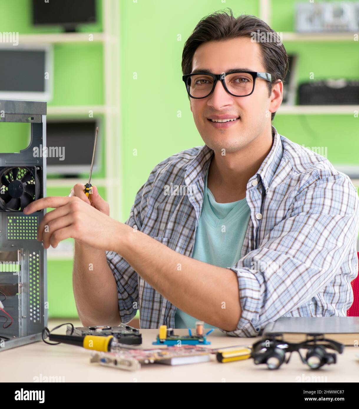 Smiling pc engineer repairing hi-res stock photography and images - Alamy