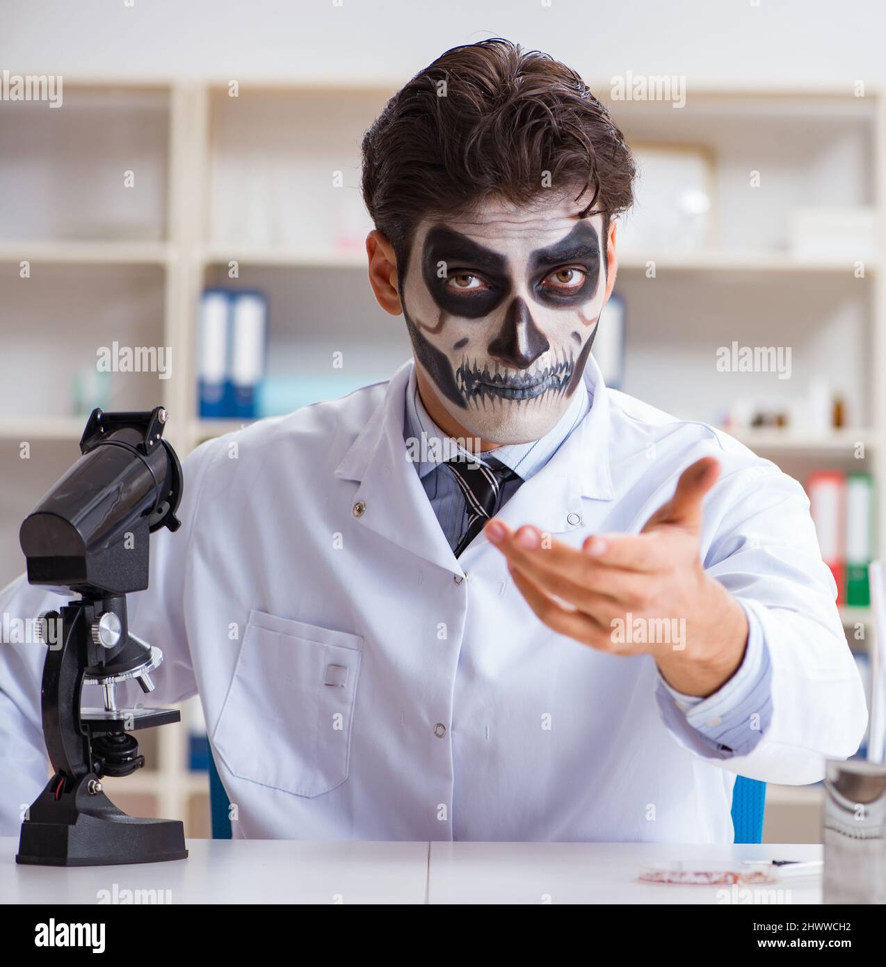 The scary monster doctor working in lab Stock Photo - Alamy