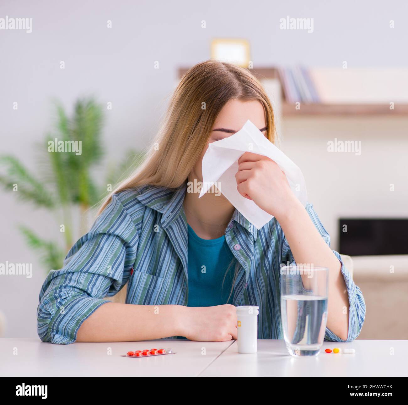 The woman taking pills to cope with pain Stock Photo - Alamy