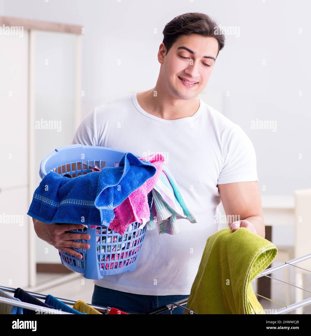 The man doing laundry at home Stock Photo - Alamy