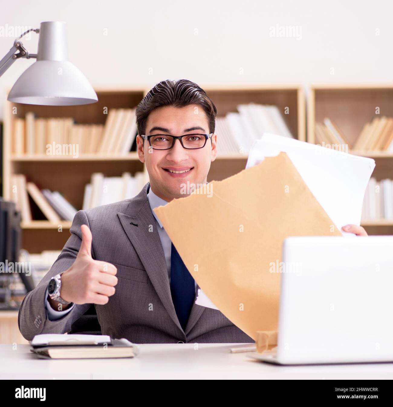 The businessman receiving letter in the office Stock Photo - Alamy