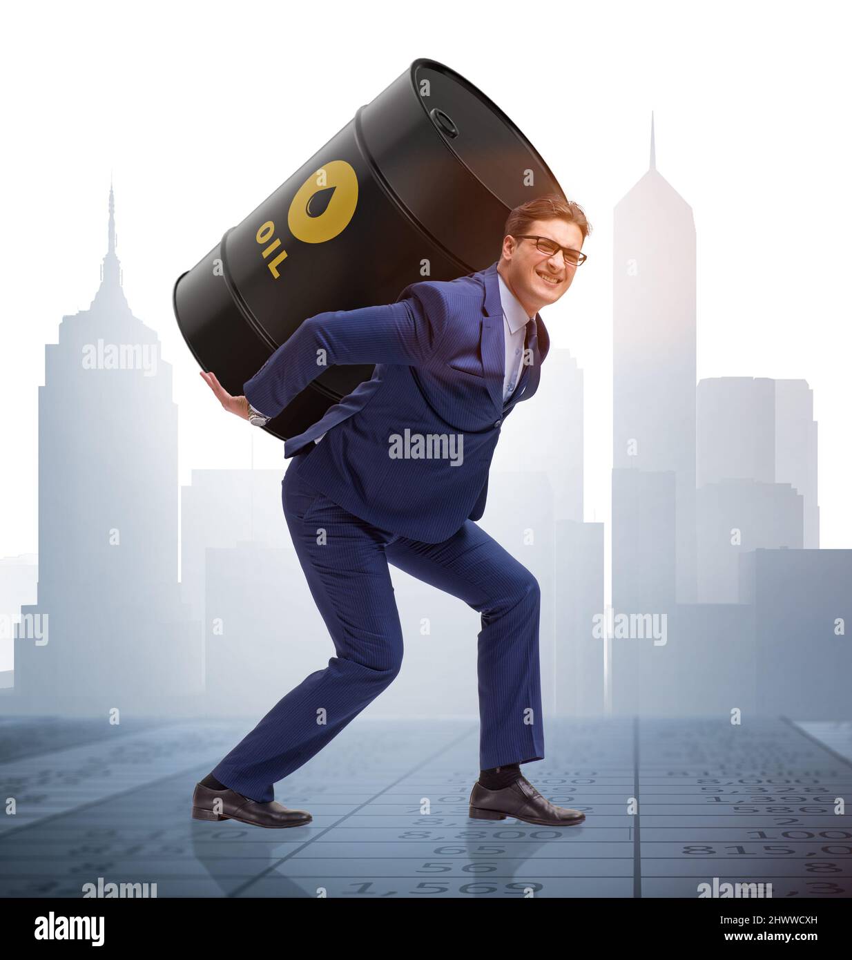 The businessman under the burden of oil barrel Stock Photo - Alamy