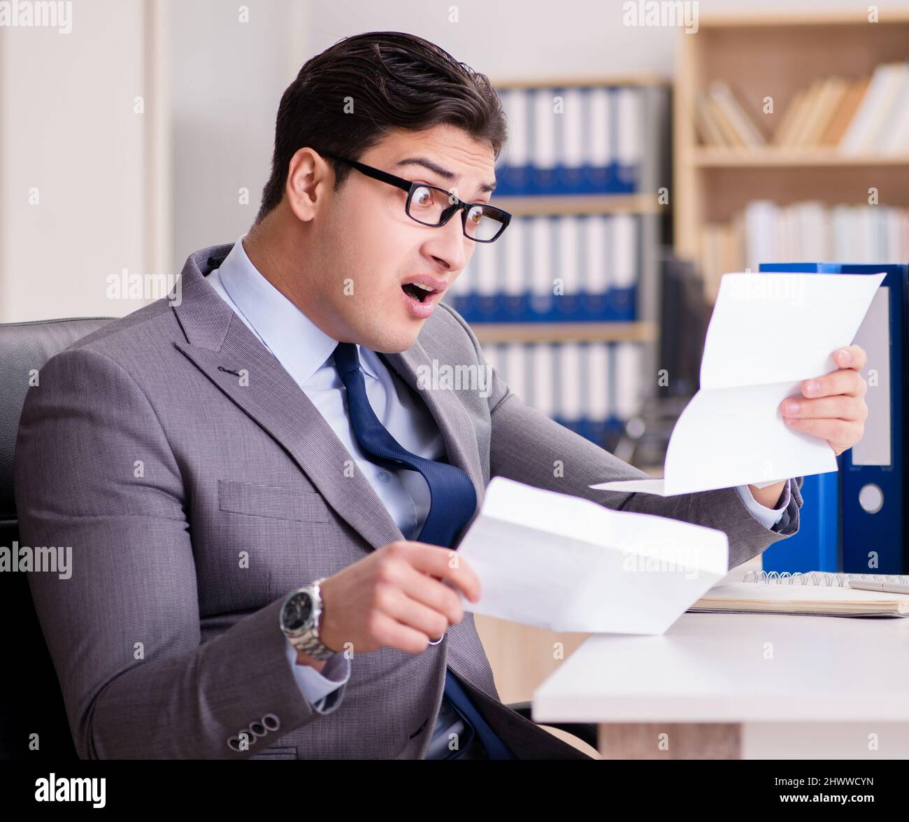 The businessman receiving letter in the office Stock Photo - Alamy