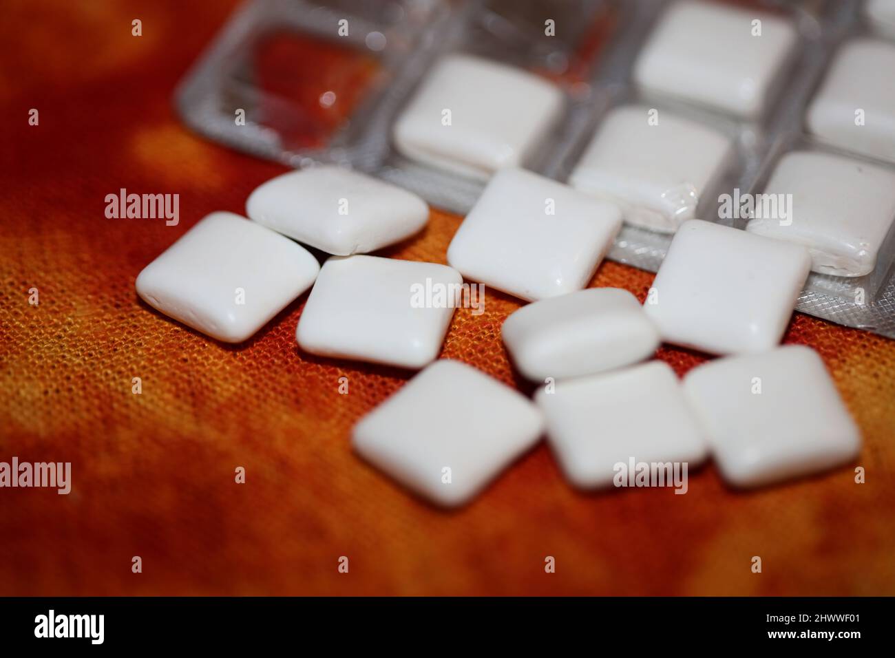 White nicotine square bubble gums close up smoking mania background ...