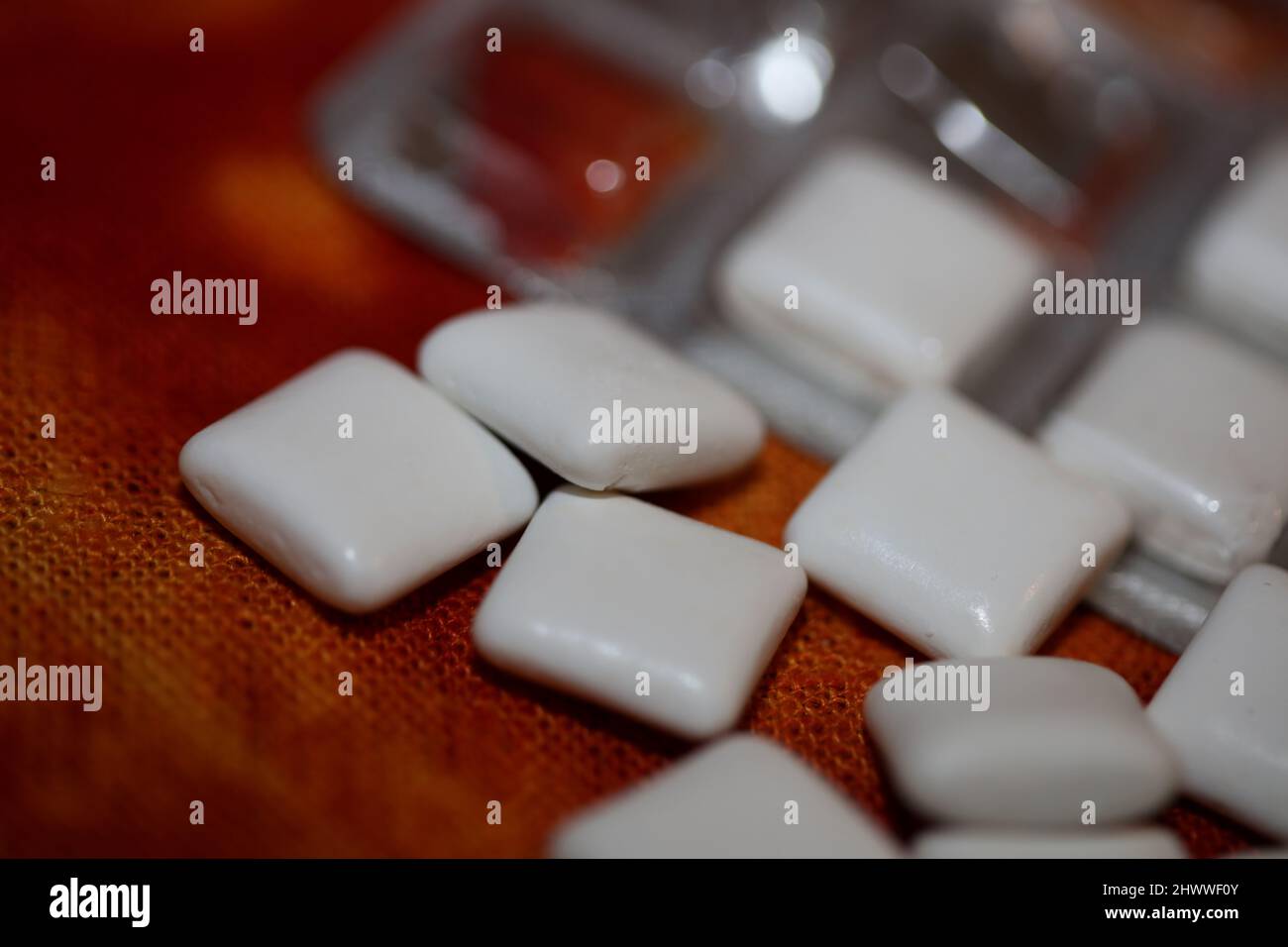 White nicotine square bubble gums close up smoking mania background ...