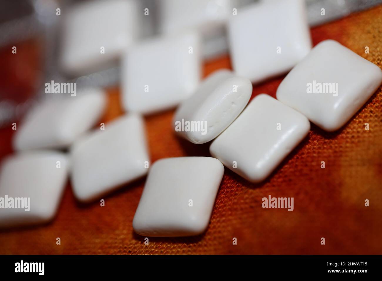 White nicotine square bubble gums close up smoking mania background ...