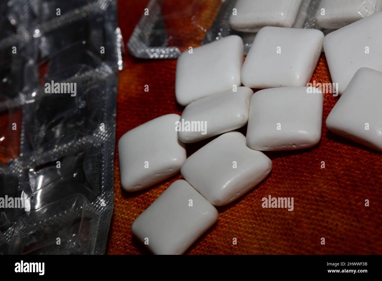 White nicotine square bubble gums close up smoking mania background ...