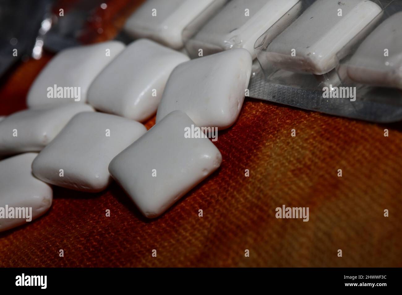 White nicotine square bubble gums close up smoking mania background ...