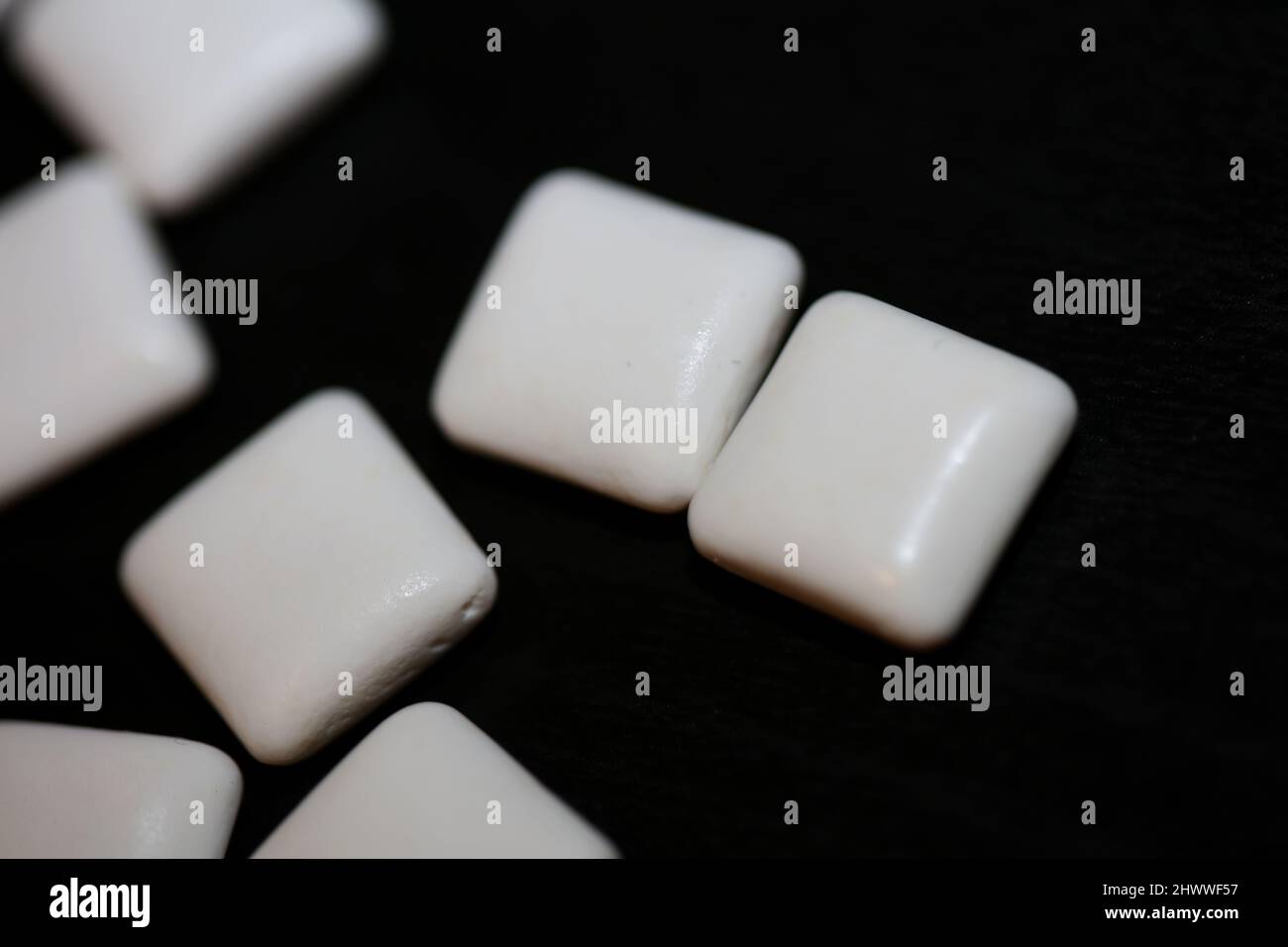 White nicotine square bubble gums close up smoking mania background ...