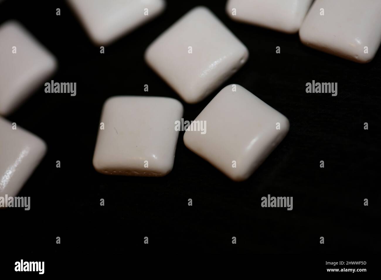 White nicotine square bubble gums close up smoking mania background ...