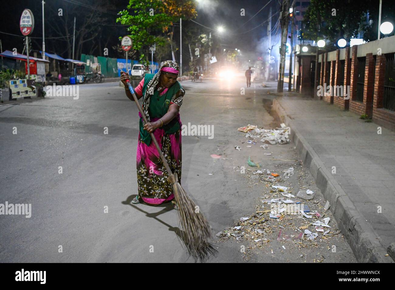 Dhaka, Bangladesh. 08th Mar, 2022. Halima, a cleaning worker of the city corporation, is seen ...