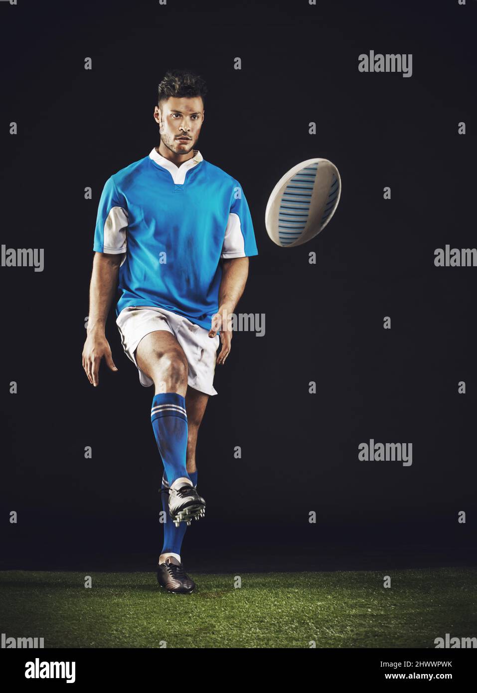 Hes at the top of his game. Full length studio shot of a young rugby ...