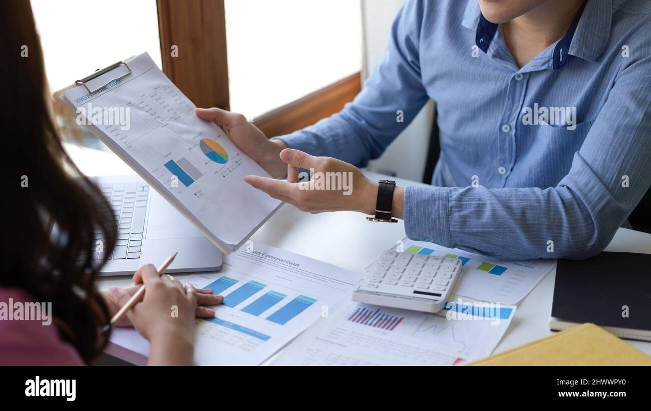 Close-up image, Male marketing manager showing the business model graph ...