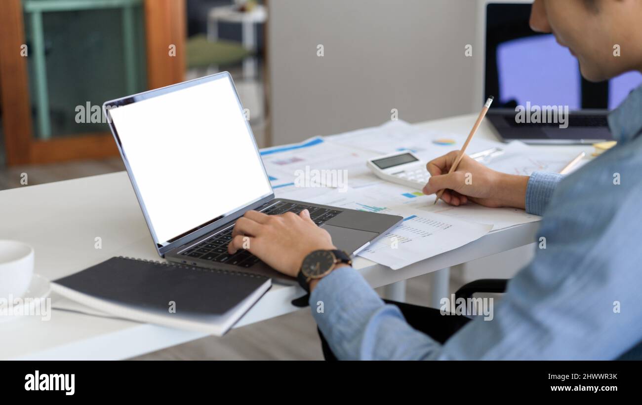 Close-up image, Male accountant is working on notebook laptop, typing ...