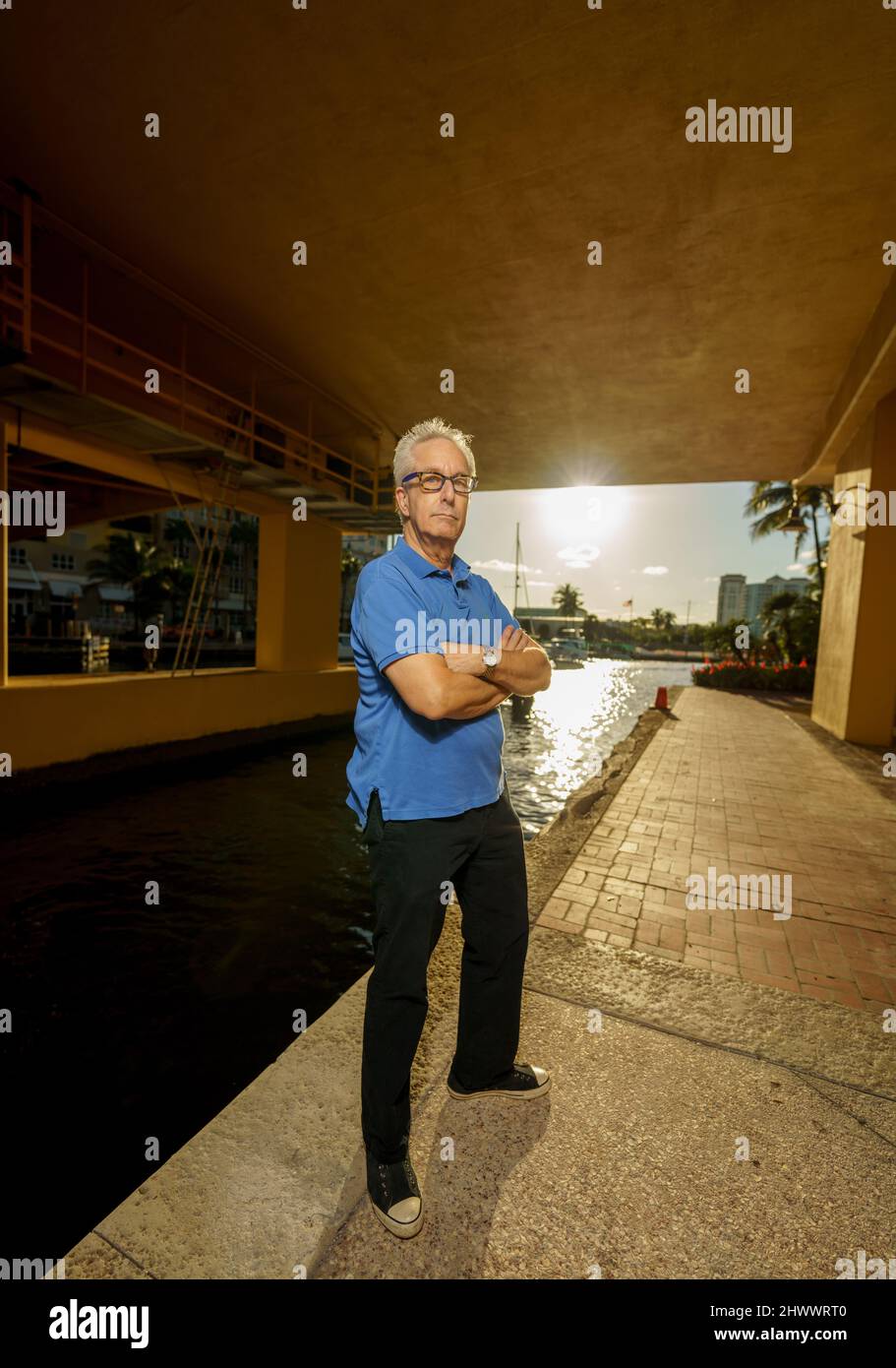 Man backlit by sun and lit with flash soft box Stock Photo - Alamy