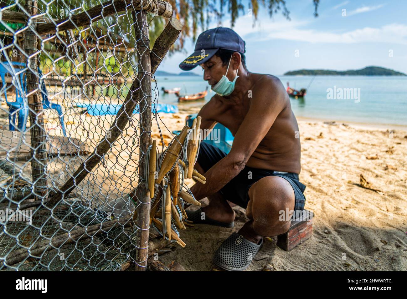 Phuket, Thailand. 08th Mar, 2022. A fisherman builds a large trap at ...