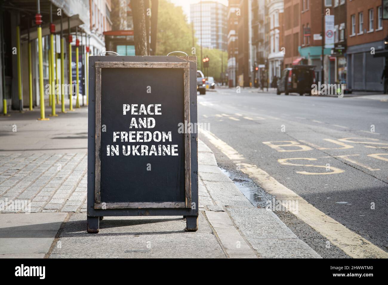 Peace and freedom in Ukraine. Foldable advertising poster on the street ...