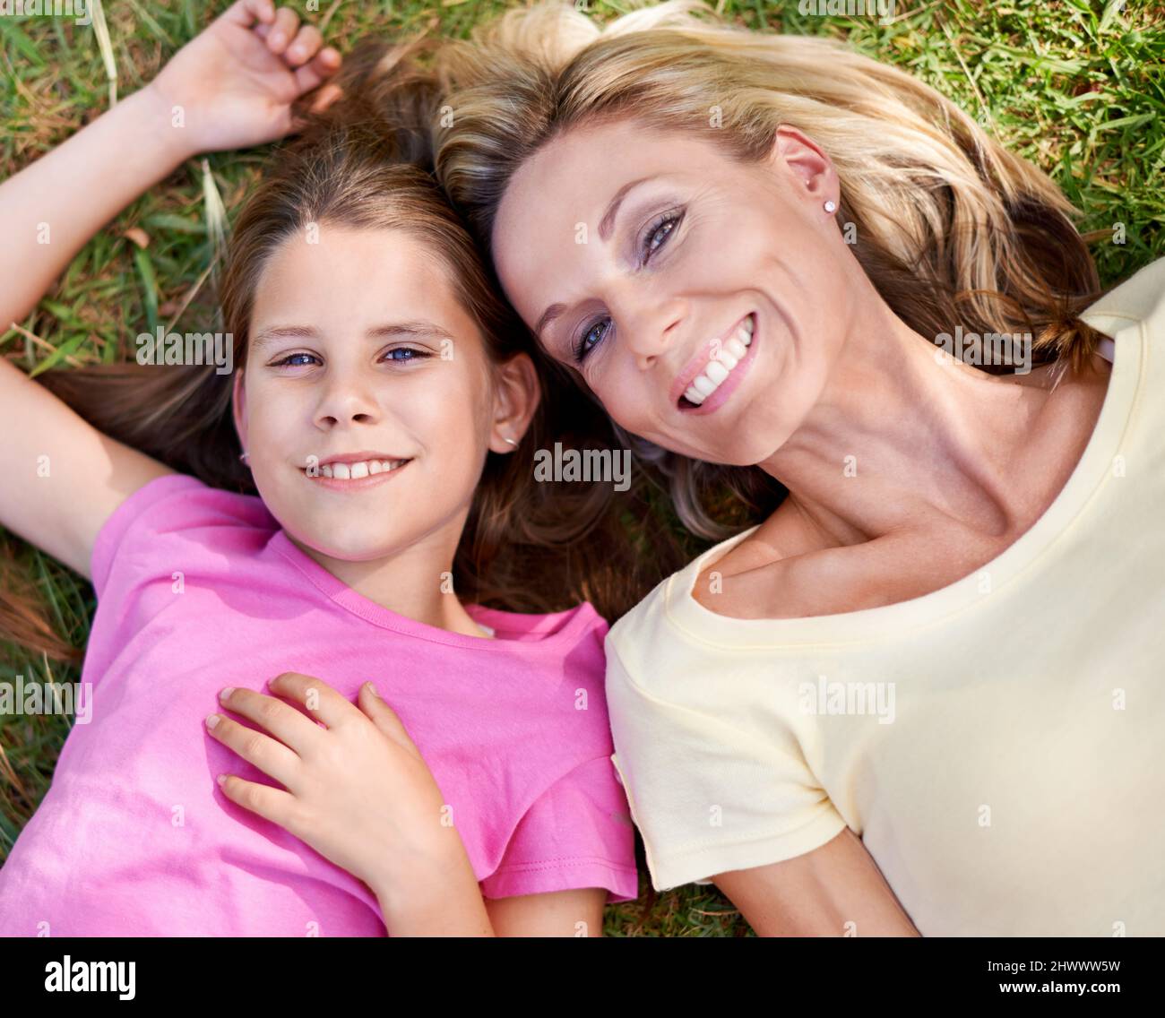 Spending Time With Mom A Happy Mother And Her Young Daughter Lying On