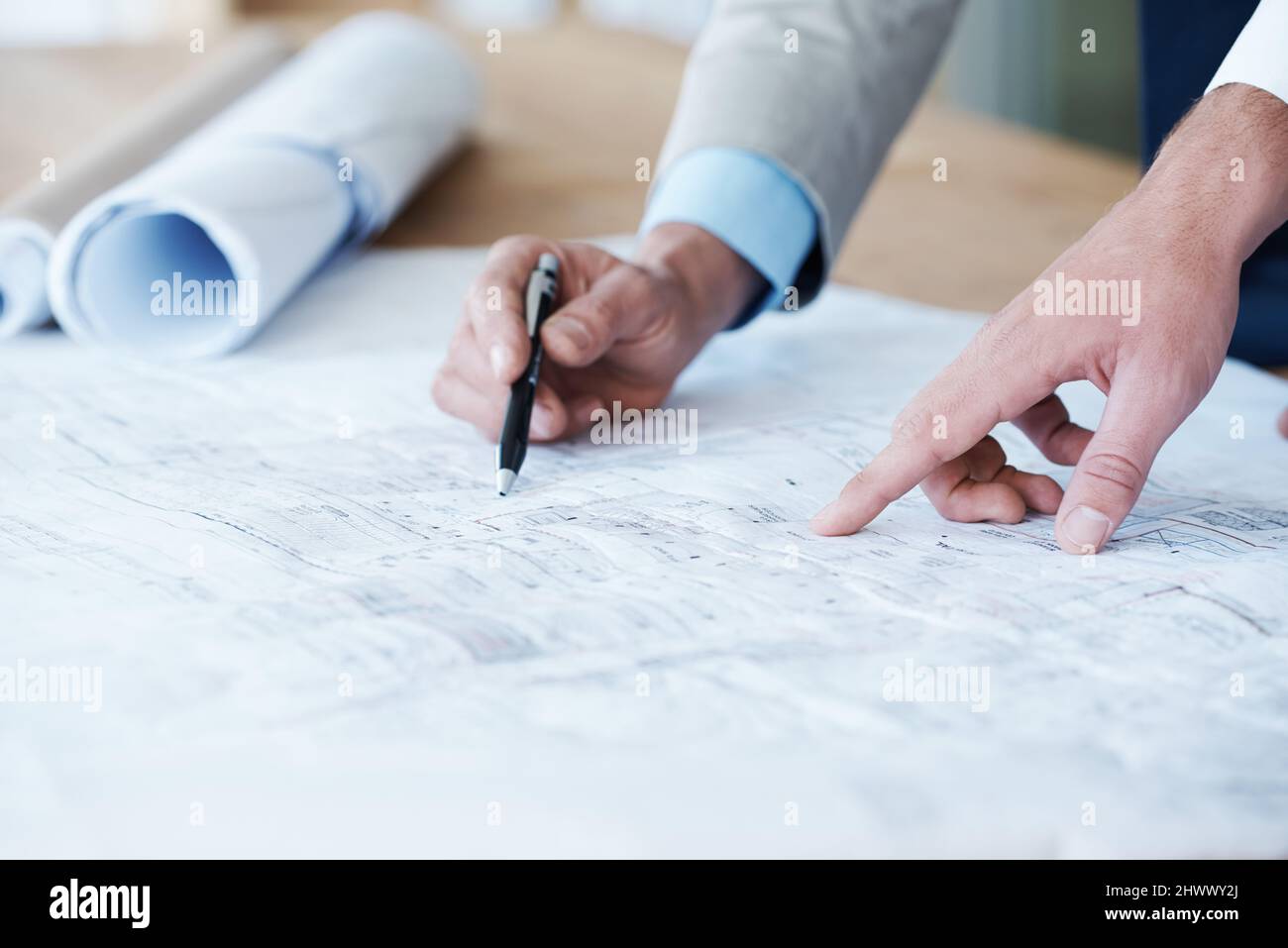 Ready to build their empire. Close up of architects going over the ...