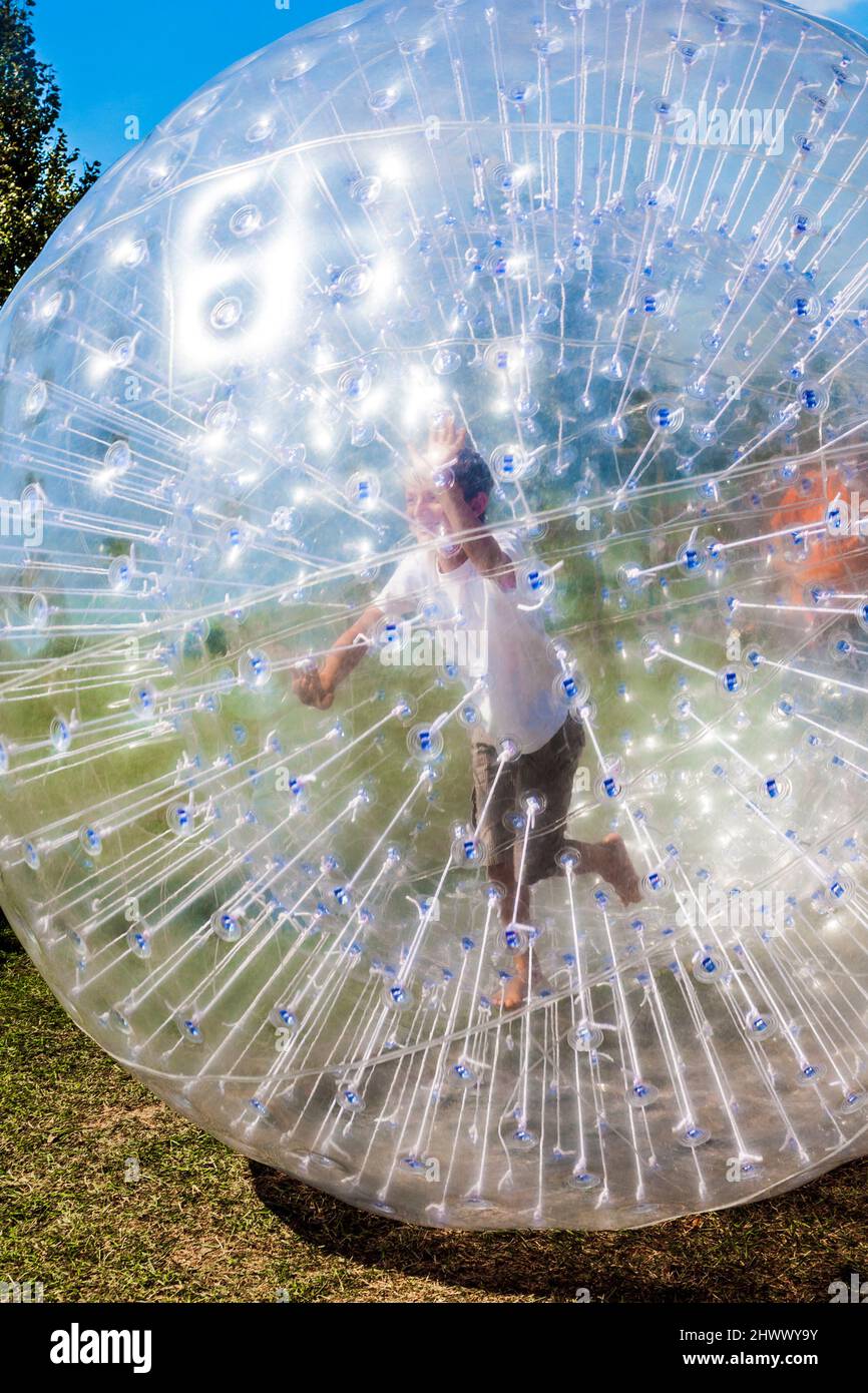 children have a lot of fun in the Zorbing Ball Stock Photo - Alamy