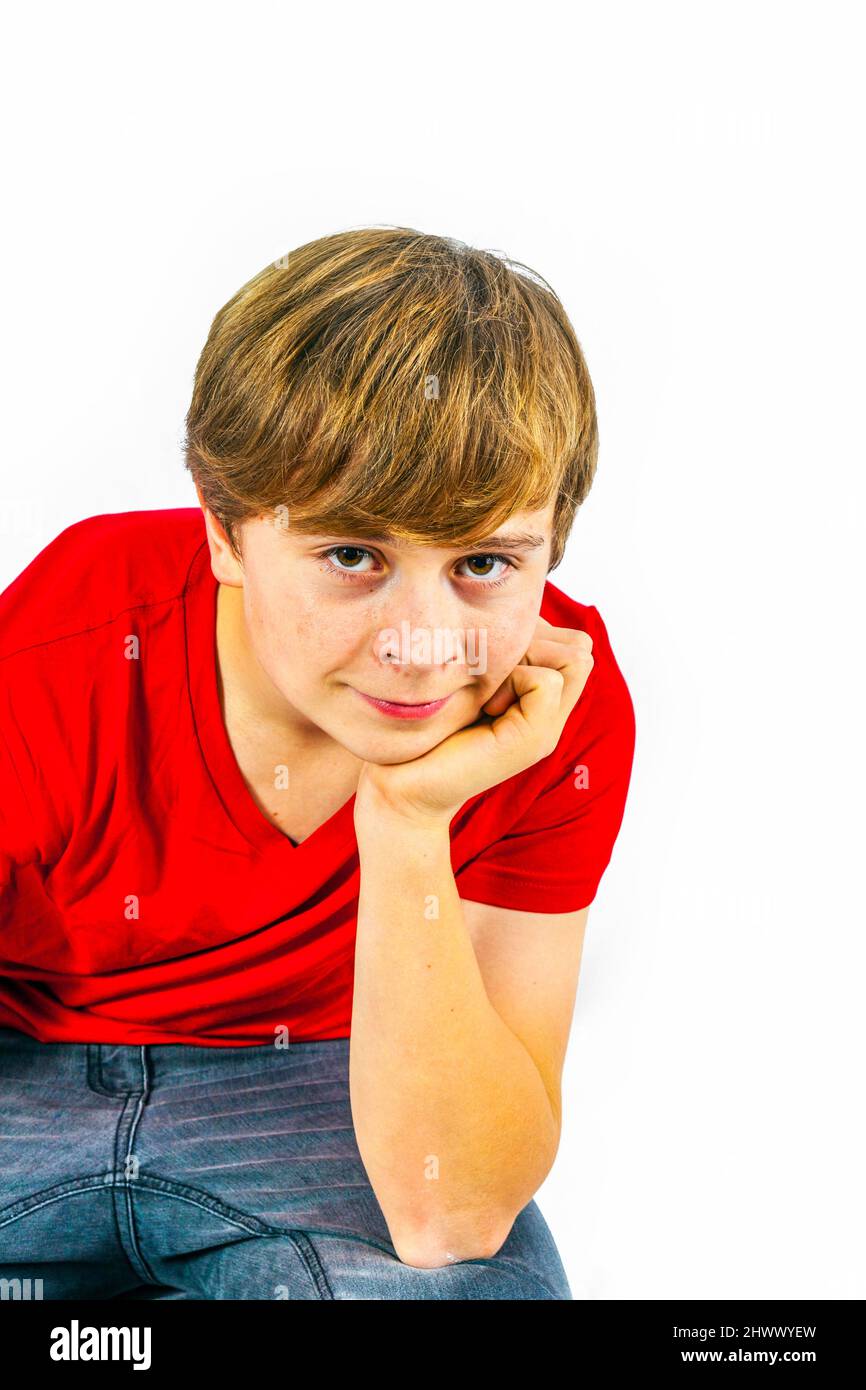 cute smart boy sitting on a chair Stock Photo - Alamy