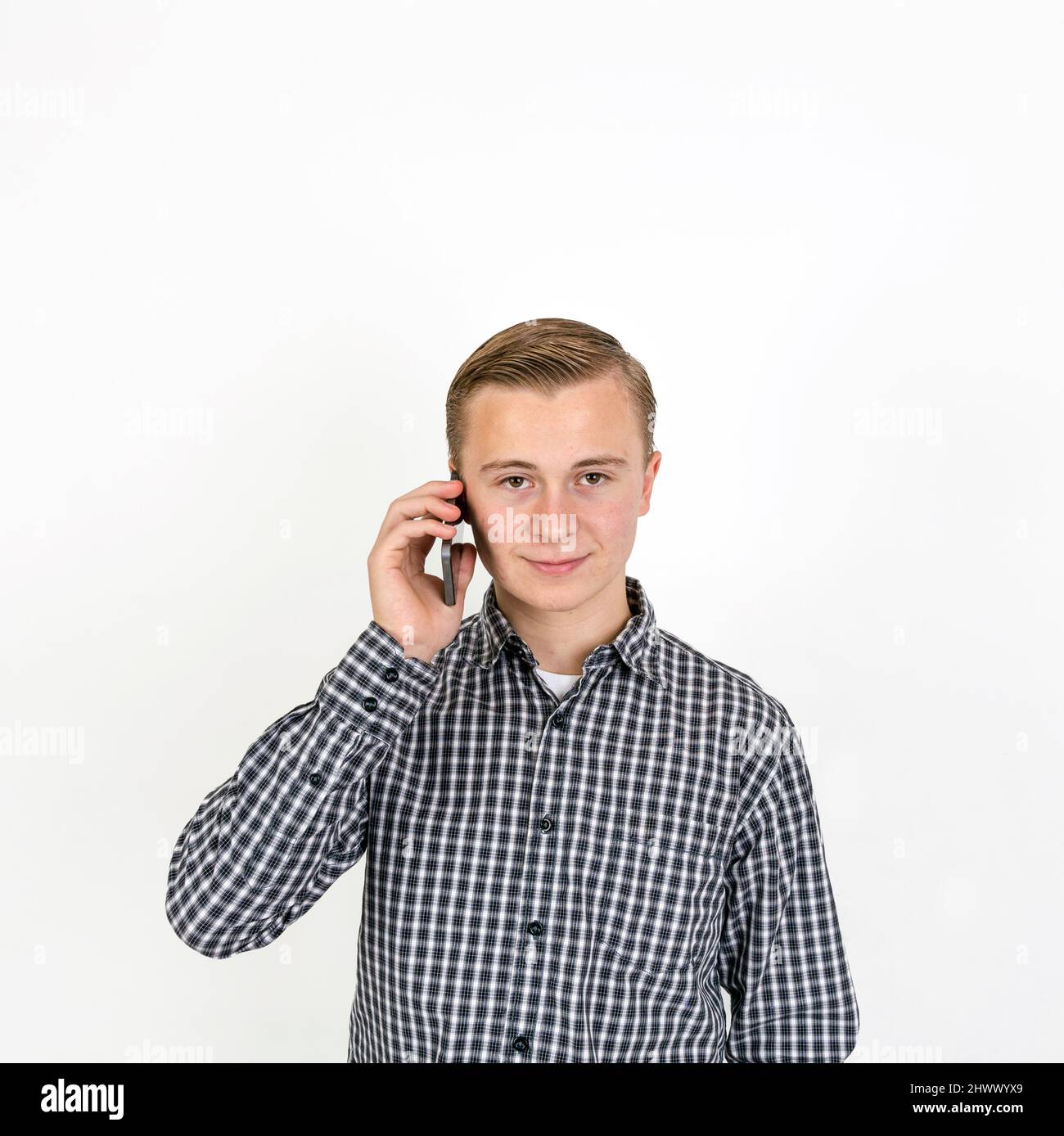 smart smiling boy uses his mobile phone Stock Photo - Alamy
