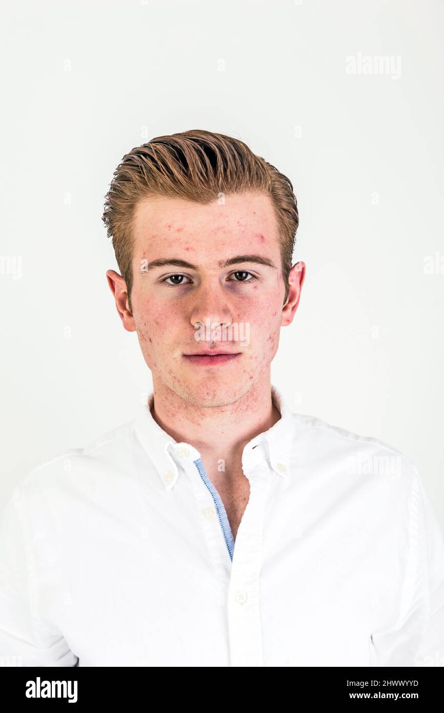portrait of smart looking teenage boy in white shirt Stock Photo - Alamy