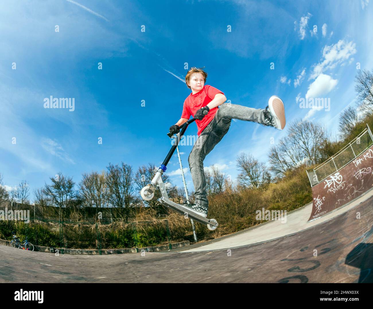 Children play outdoors jumping over hi-res stock photography and images ...