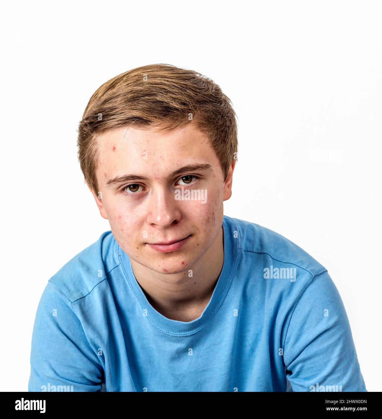 cool boy with blue shirt posing in studio Stock Photo - Alamy