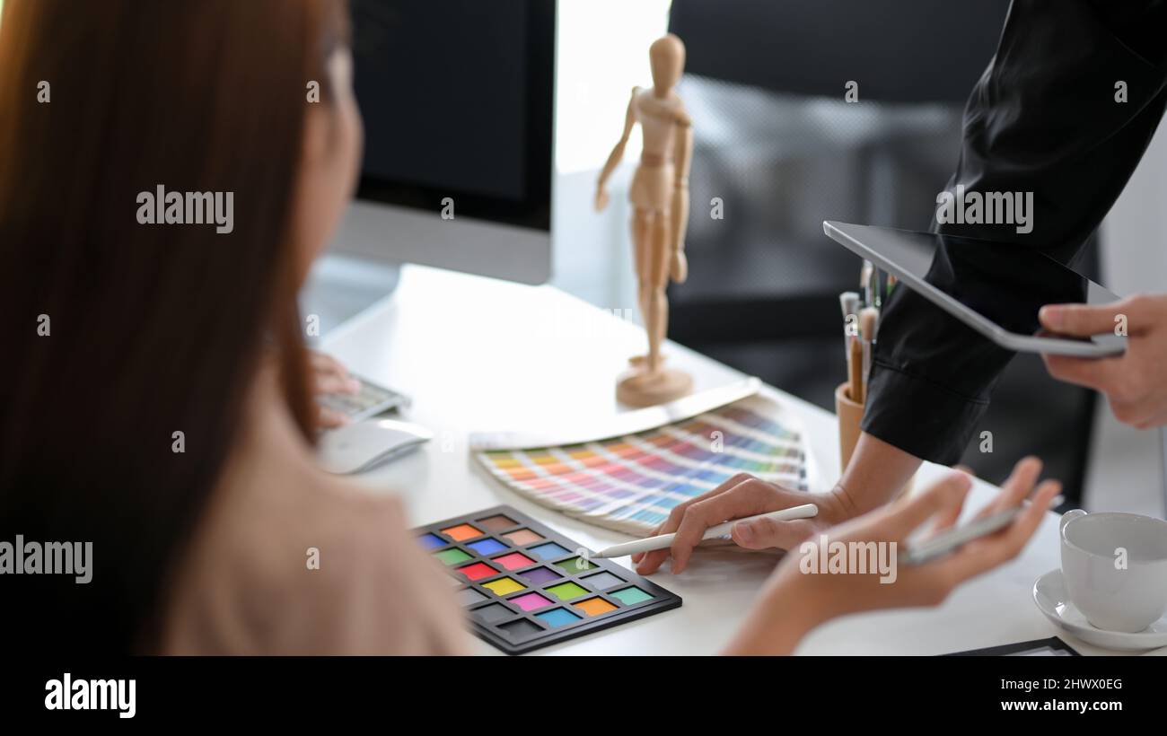 Graphic designers team or architect team discussing and sharing the ...