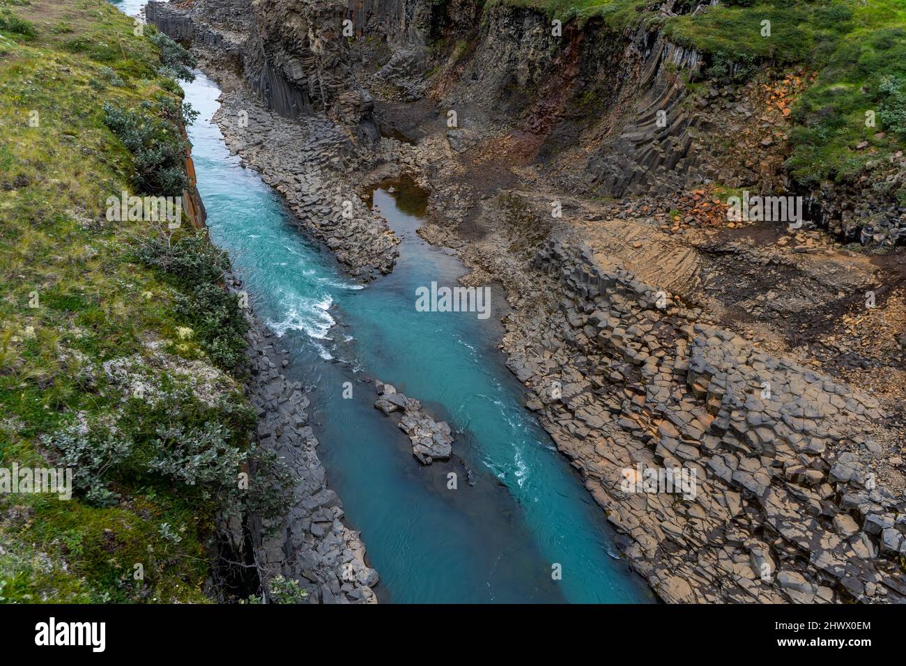 Beautiful aerial view of the studlagil canyon, and the largest number of basalt rock columns in ...