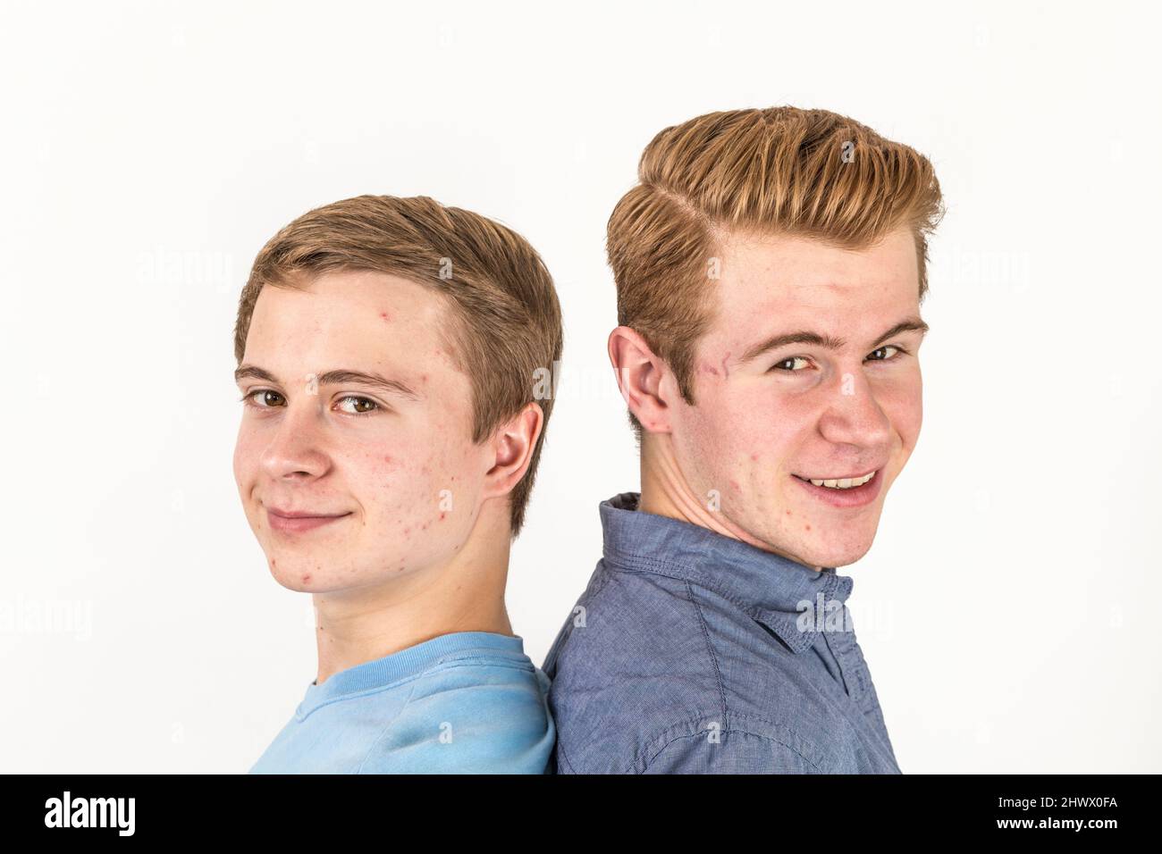 portrait of handsome brothers posing in studio Stock Photo - Alamy