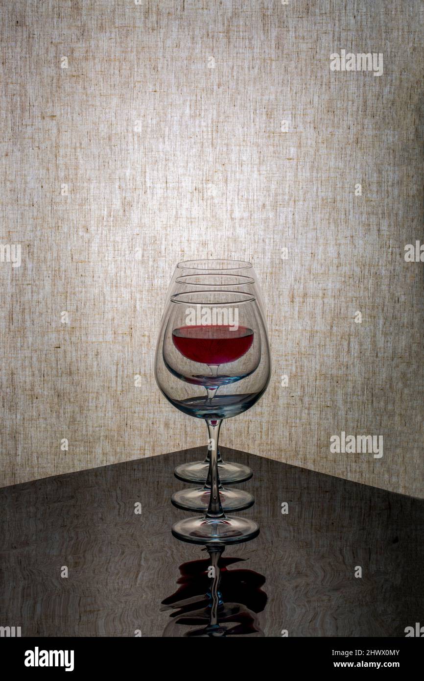 Still life with glasses on a reflective surface Stock Photo - Alamy