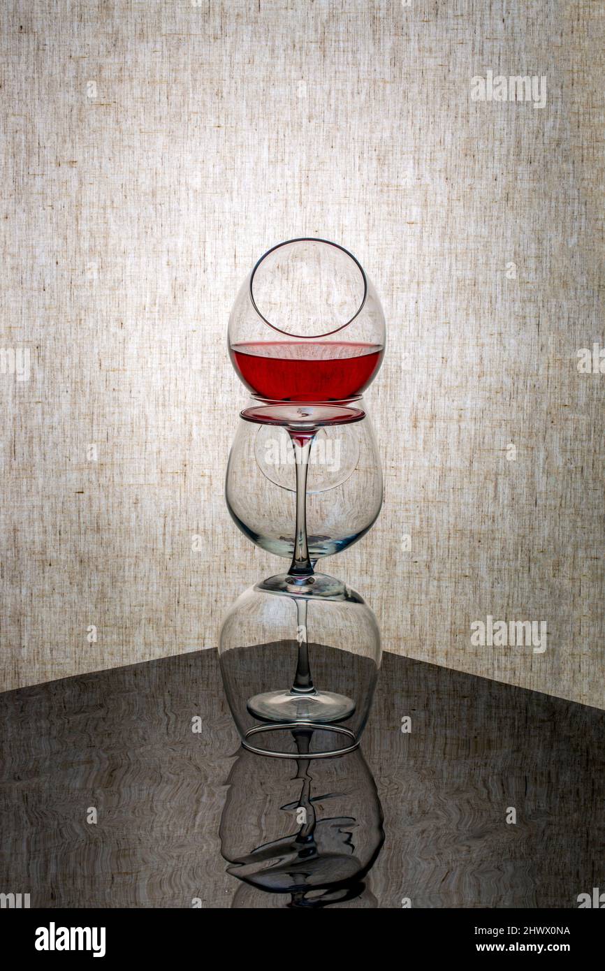 Still life with glasses on a reflective surface Stock Photo - Alamy