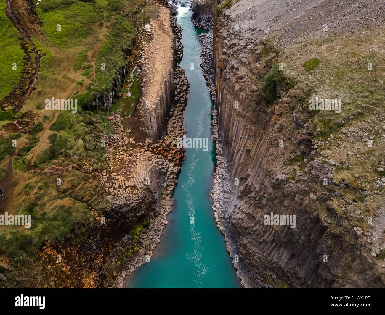Beautiful aerial view of the studlagil canyon, and the largest number of basalt rock columns in ...