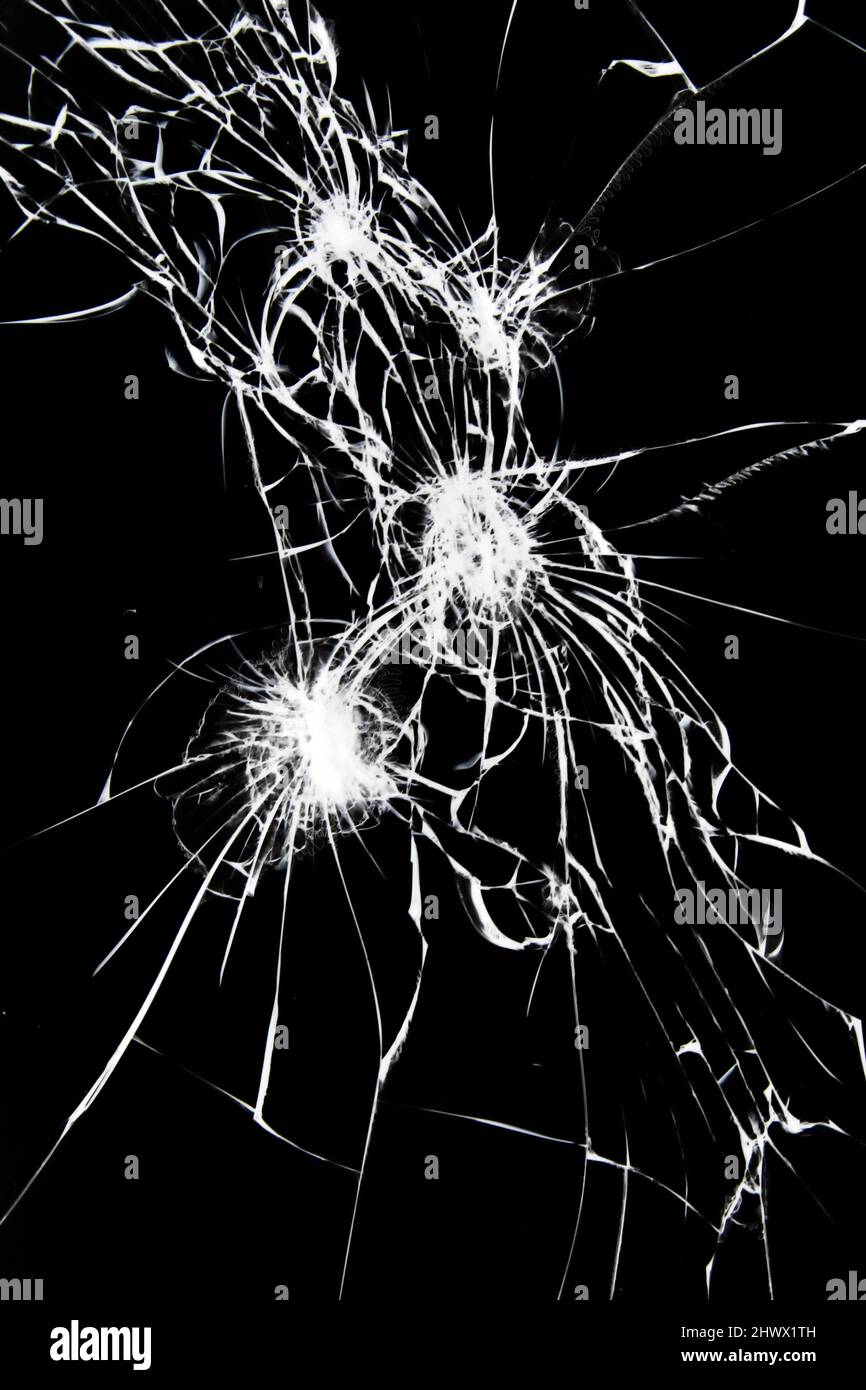 Broken black glass. Texture of cracks on the window Stock Photo - Alamy