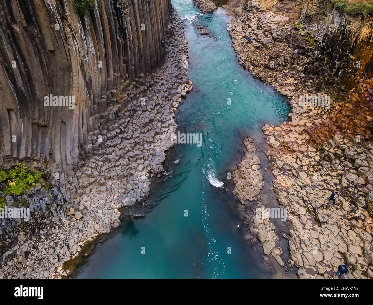 Beautiful aerial view of the studlagil canyon, and the largest number of basalt rock columns in ...